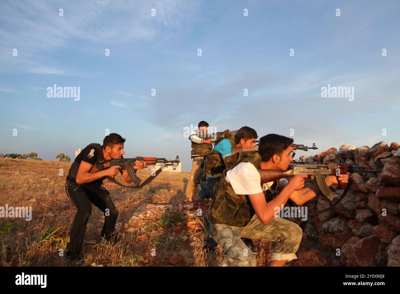 Syrian rebels firing at the Syrian Army at Menaq airport Stock Photo ...