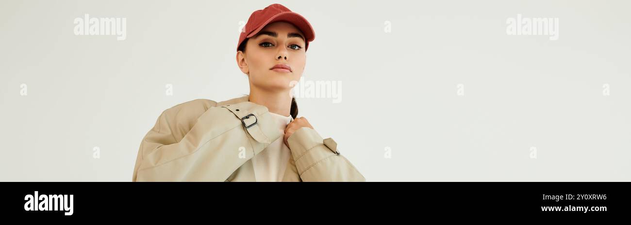 A young woman exudes confidence while posing in a chic autumn outfit ...