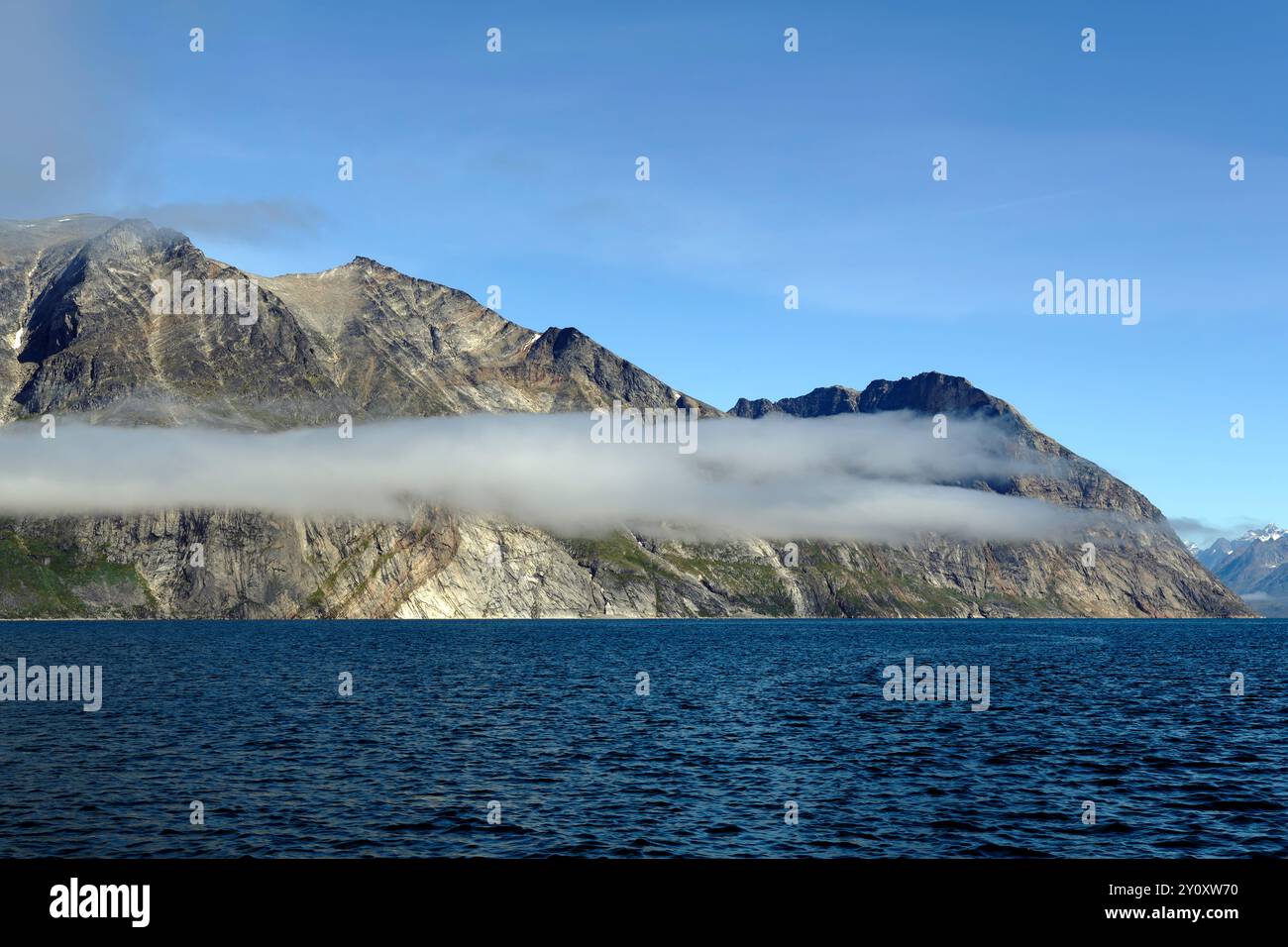 beautiful cloud/mist strata at the entrance to tasermiut Fjord ...