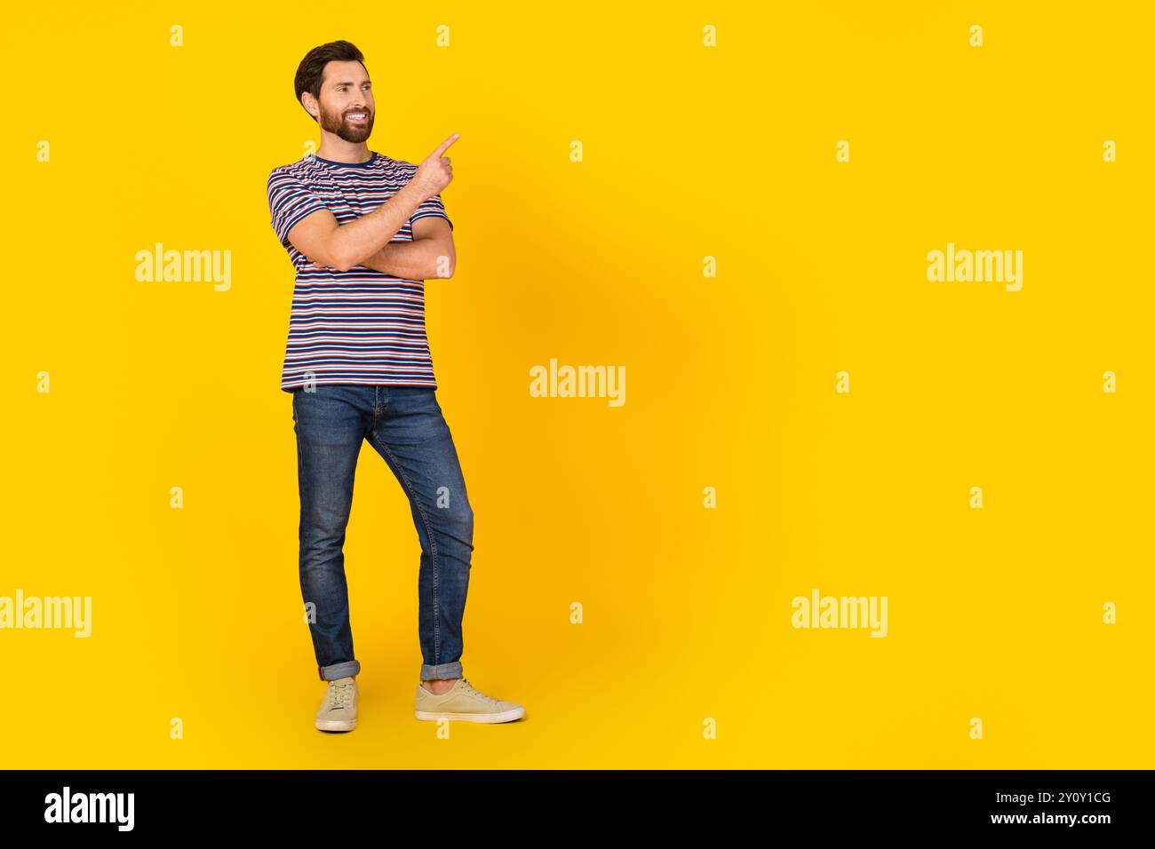 Full body length photo of model man wearing striped t shirt and denim ...