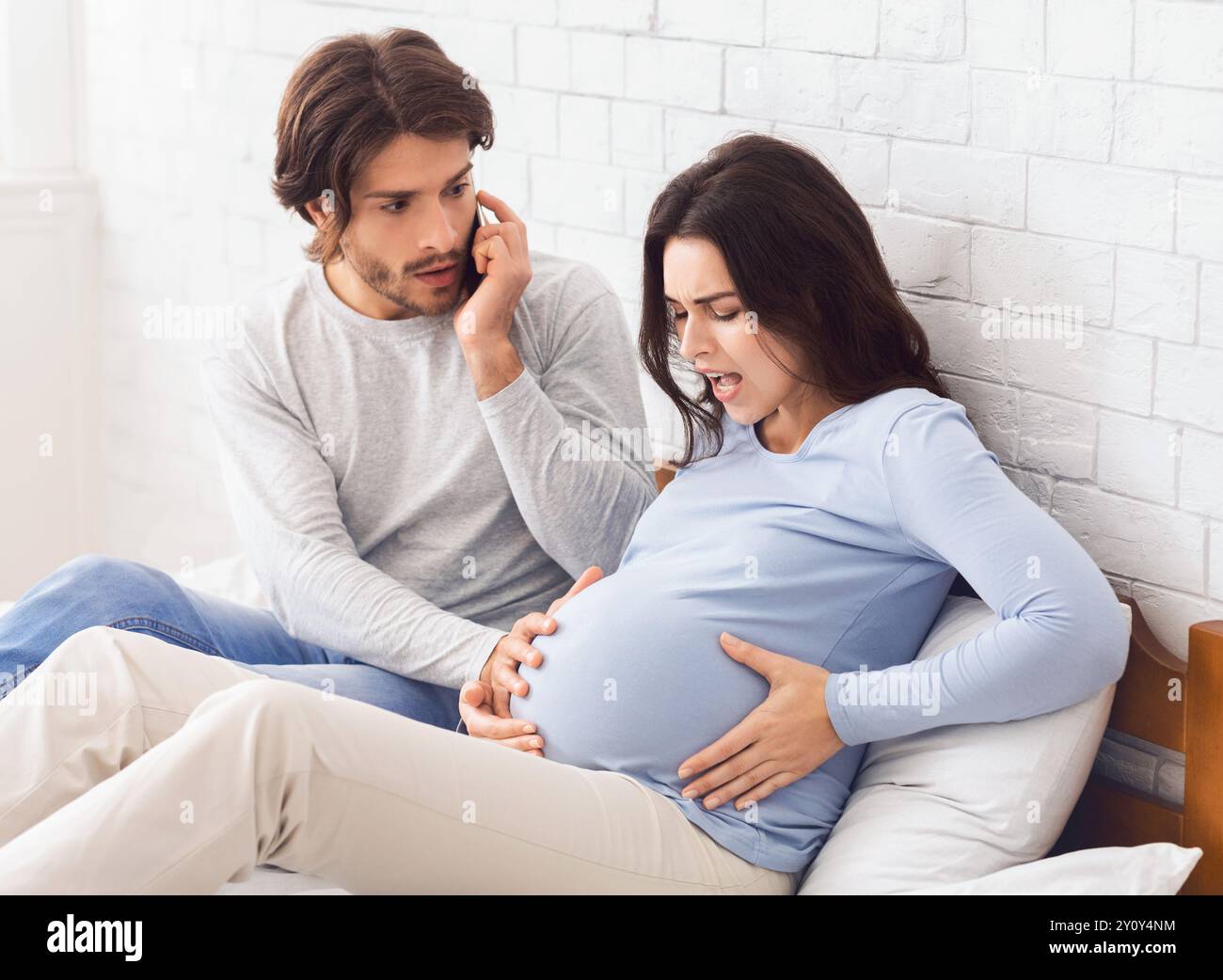 Pregnant Woman Having Contractions, Her Panicked Husband Calling Doctor ...