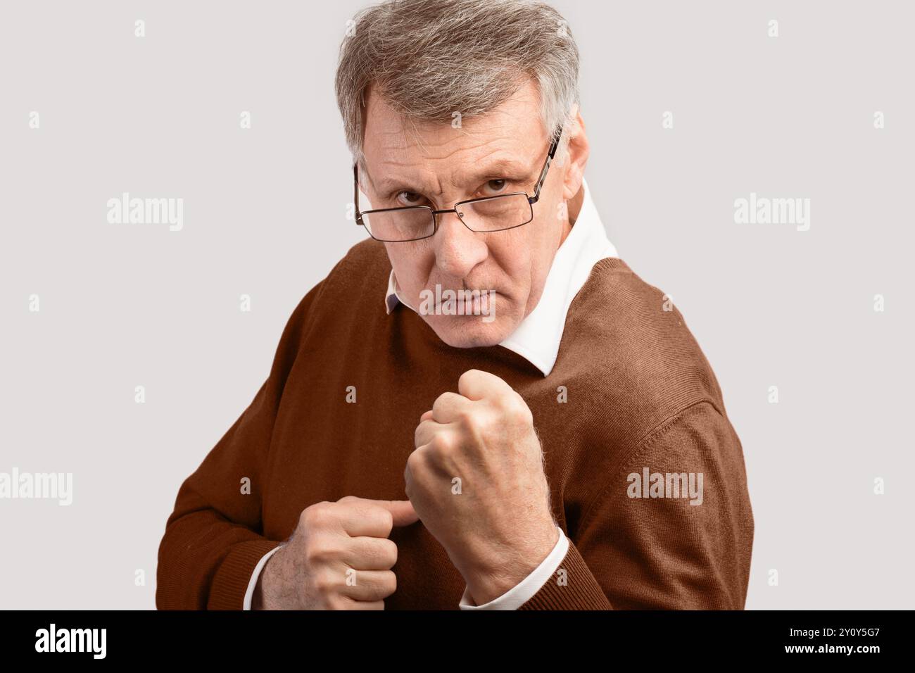 Angry elderly man clenching hi-res stock photography and images - Alamy