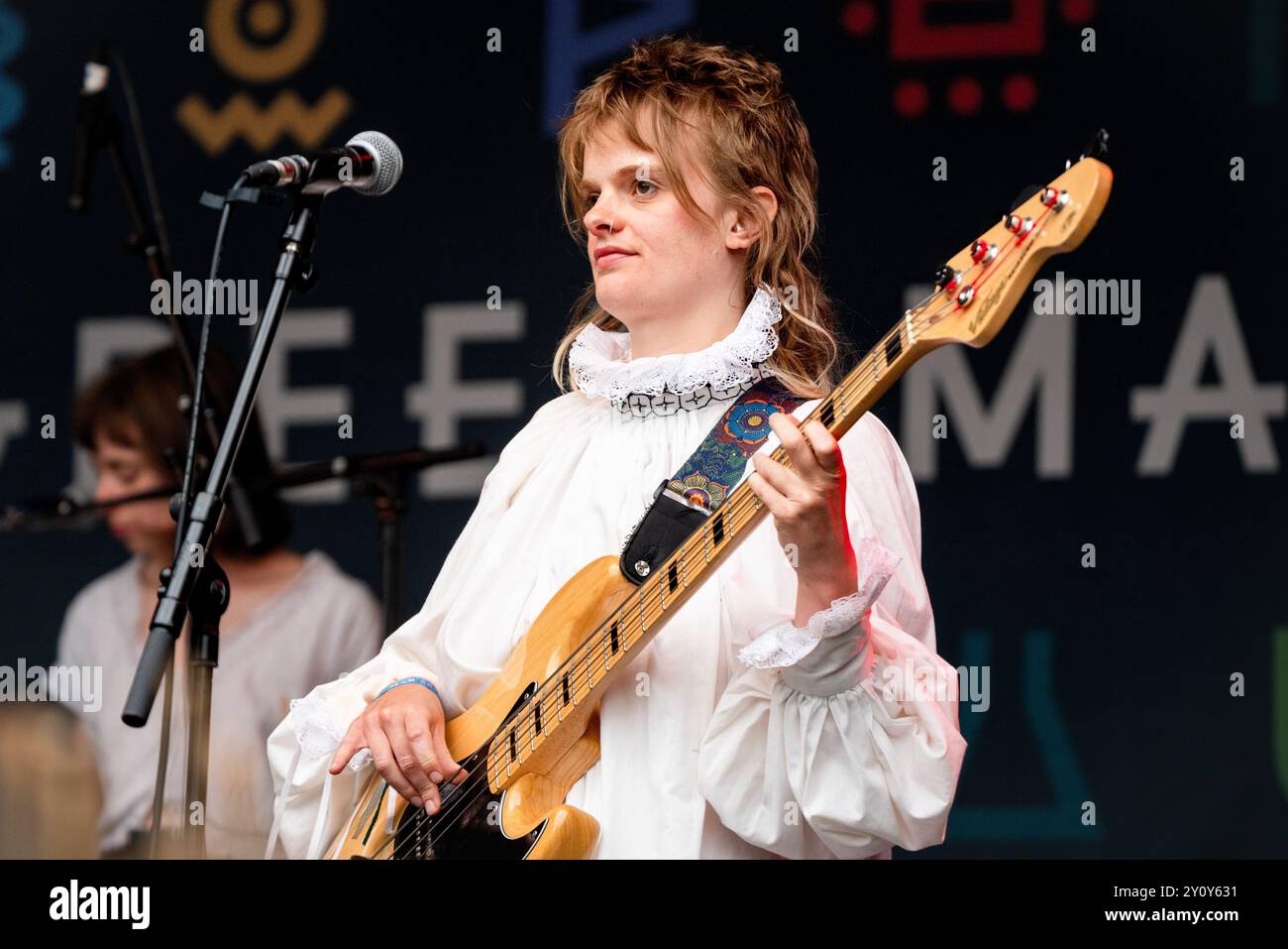 Female bassist singing on stage hi-res stock photography and images - Alamy