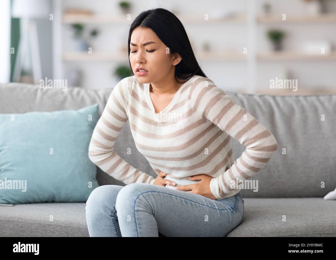 Stomach Ache. Sick Asian Woman Suffering From Acute Abdominal Pain At ...