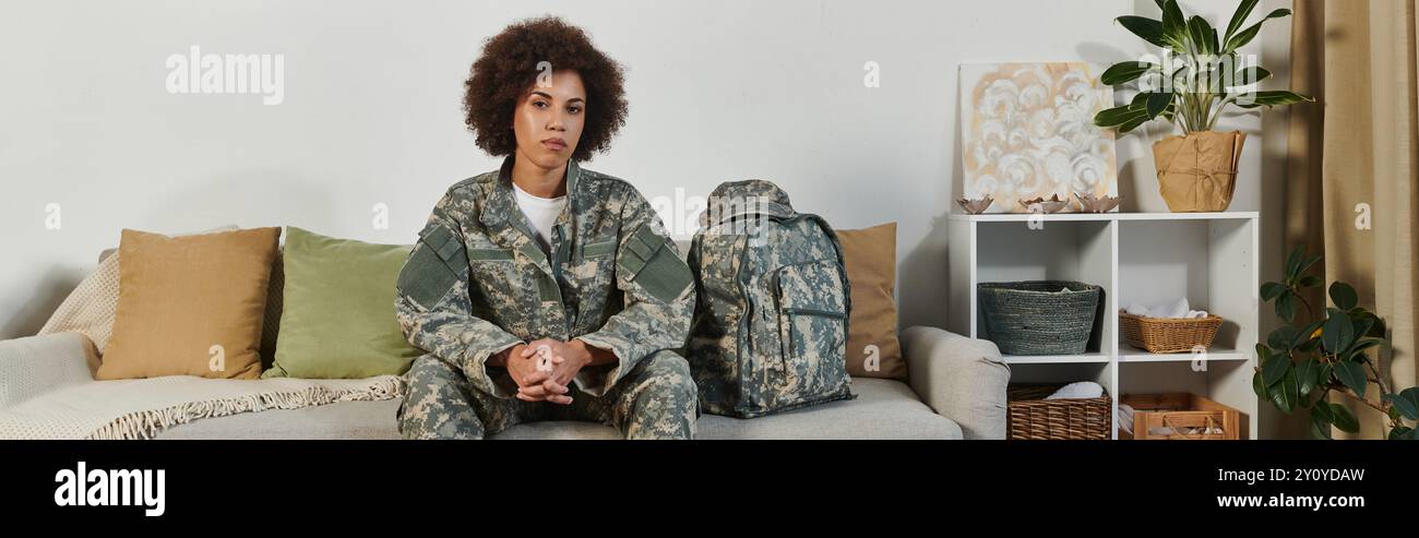 A female soldier sits thoughtfully in her living room, ready to embark ...