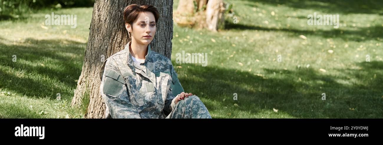 A young woman in military uniform enjoys a moment of reflection upon ...