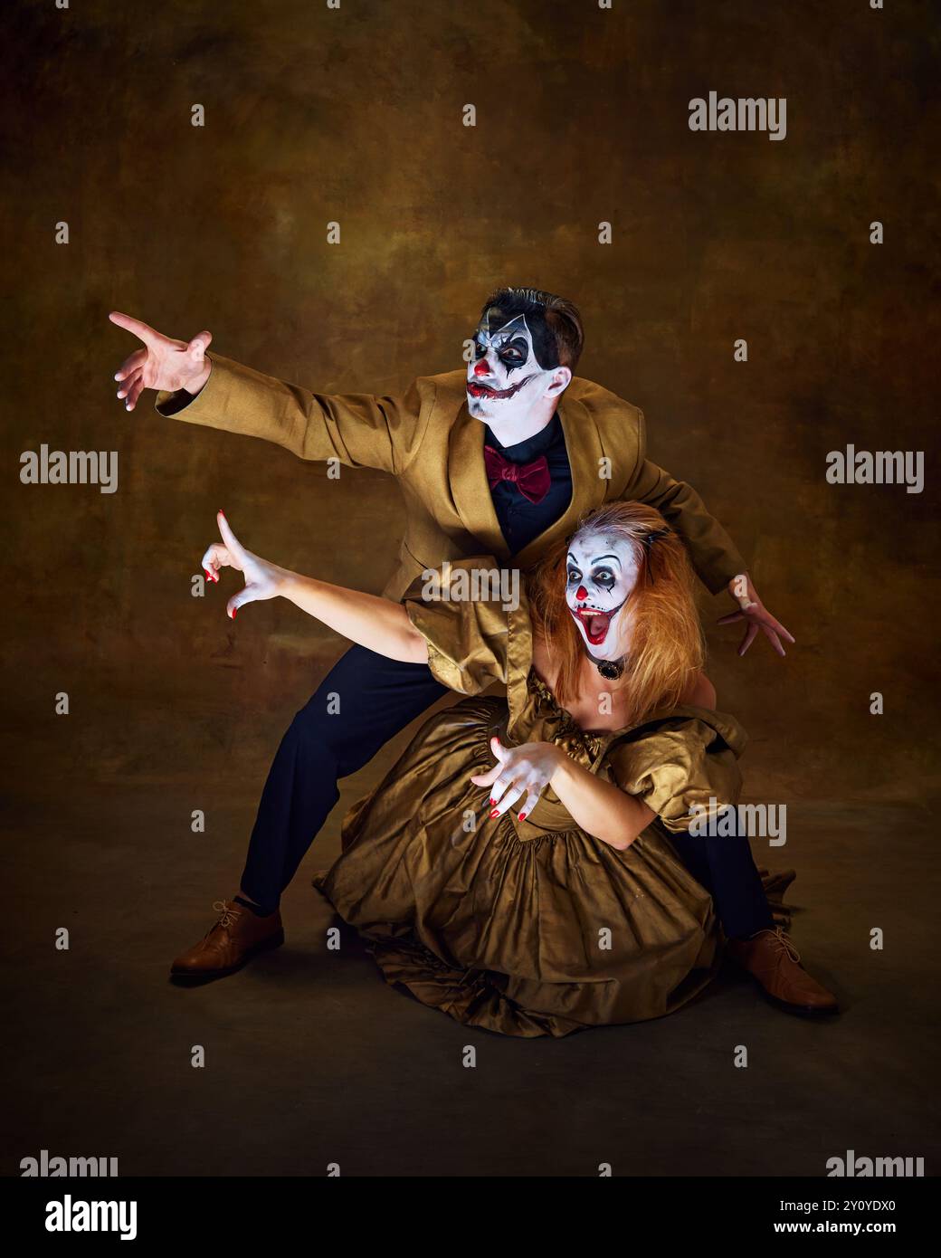 Clowns strike theatrical pose, pointing in unison like they're plotting ...