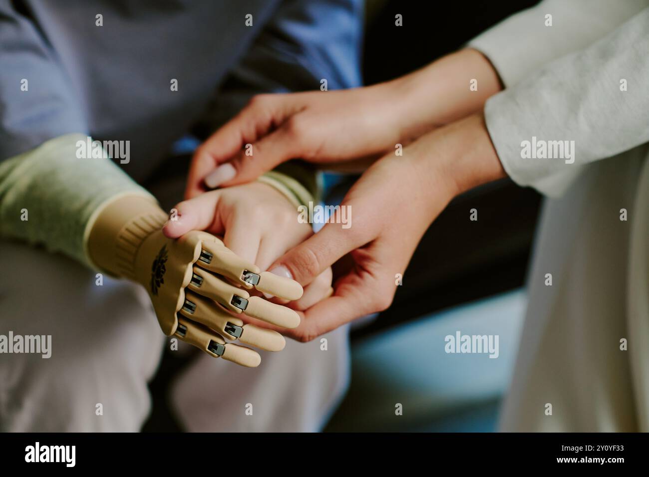 Holding Metal Prosthetic Hand in Gentle Support Stock Photo - Alamy