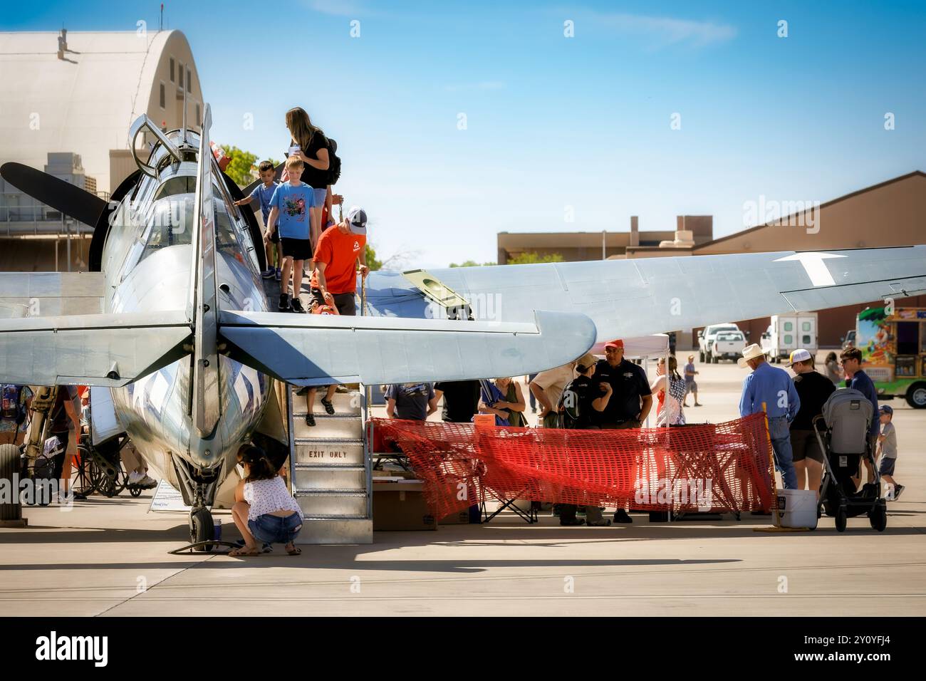 Airshow fans peek in to the cockpit of TBM Avenger at the 2024 Legacy ...
