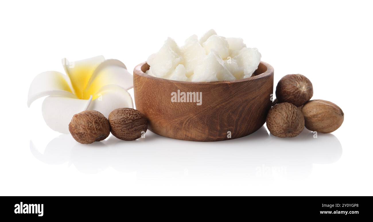 Natural shea butter, nuts and plumeria flower isolated on white Stock ...