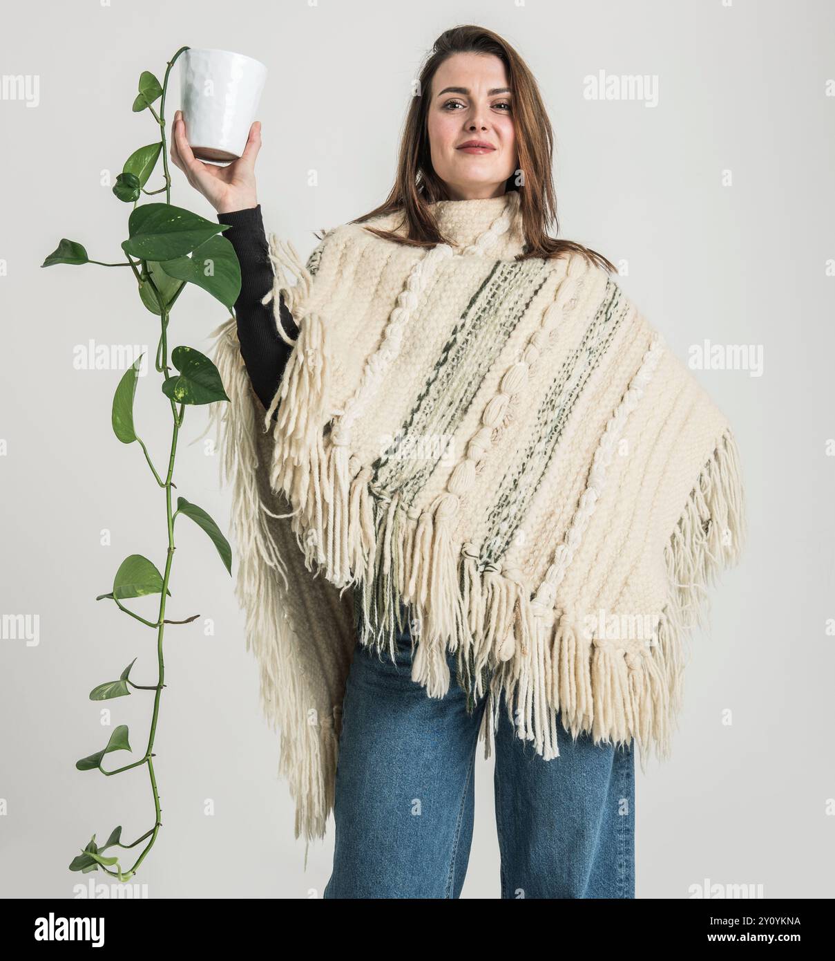 Woman wearing poncho hi-res stock photography and images - Alamy