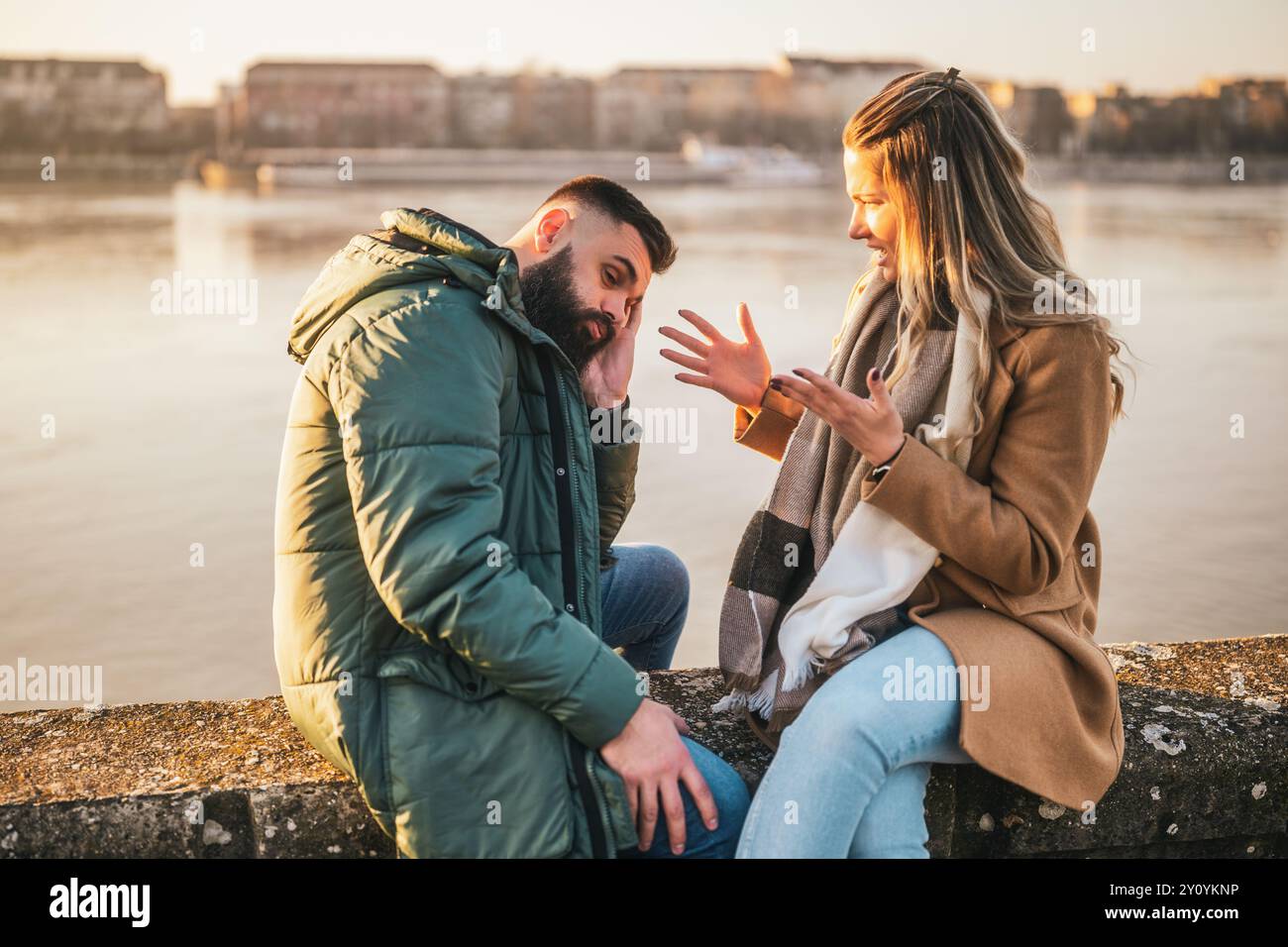 Couple having conflict and they are arguing while sitting outdoor Stock ...