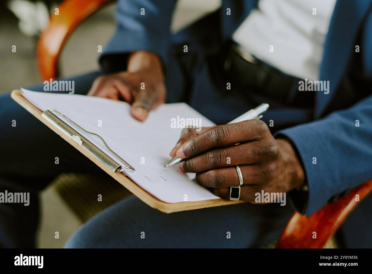 Taking Notes on Clipboard During Business Meeting Stock Photo - Alamy