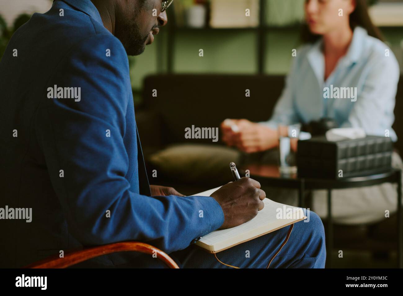 Businessman Taking Notes in a Meeting Room Stock Photo - Alamy