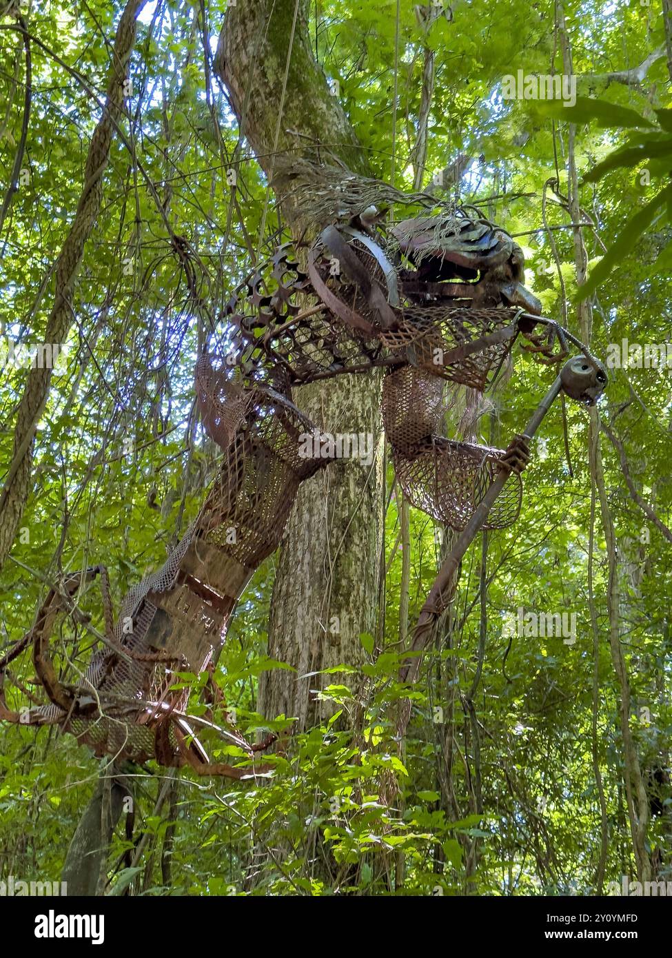 Metal sculpture of La Bruja, a mythical witch creature along a trail in ...