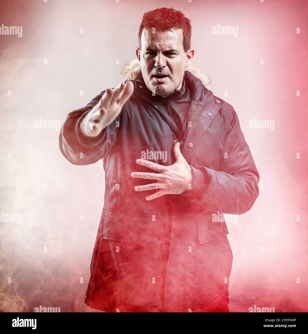Man expressing anger surrounded by red mist Stock Photo - Alamy