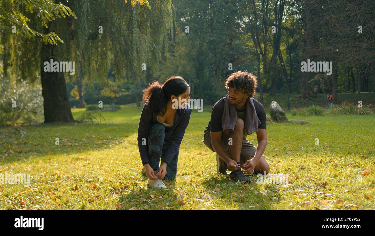 Two people woman man runners sportive girl guy Indian Arabian couple ...