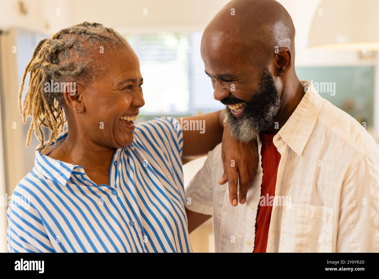 Embracing and laughing together, smiling couple enjoying each other's ...