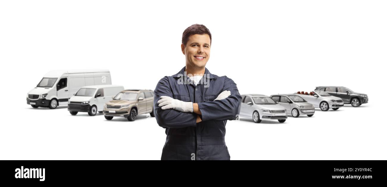 Car mechanic worker in a navy blue uniform posing with crossed arms in ...