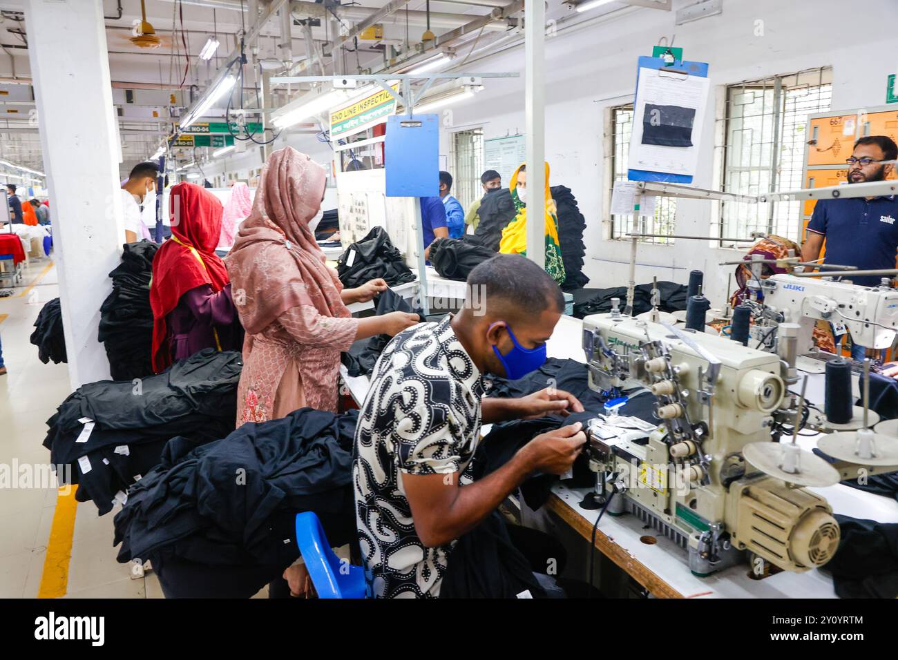 Garment workers are working at the factory , in Dhaka, Bangladesh, July 24 , 2024 Stock Photo ...