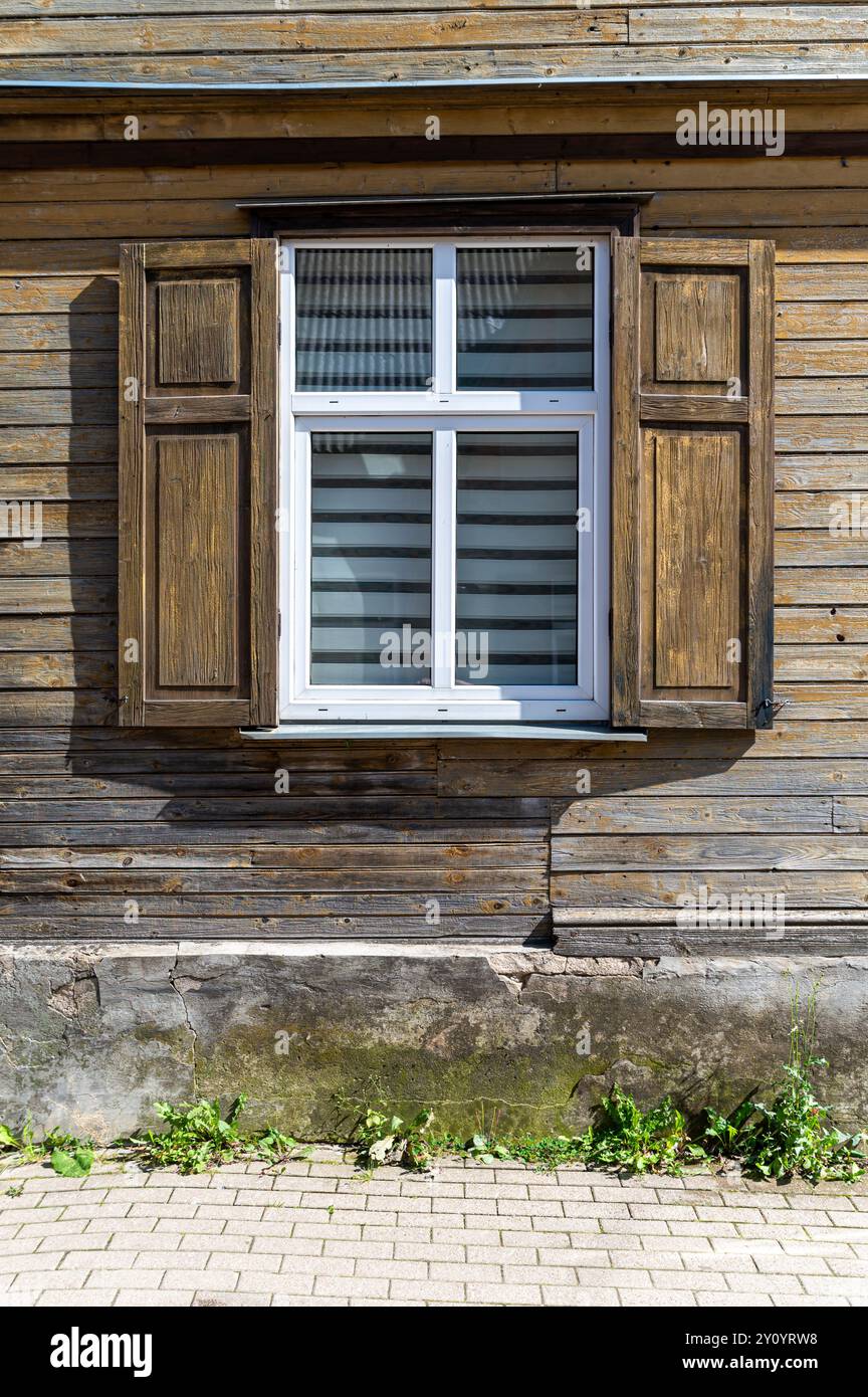 The wooden shutters of a window are wide open, revealing a bright, cheerful interior Stock Photo ...