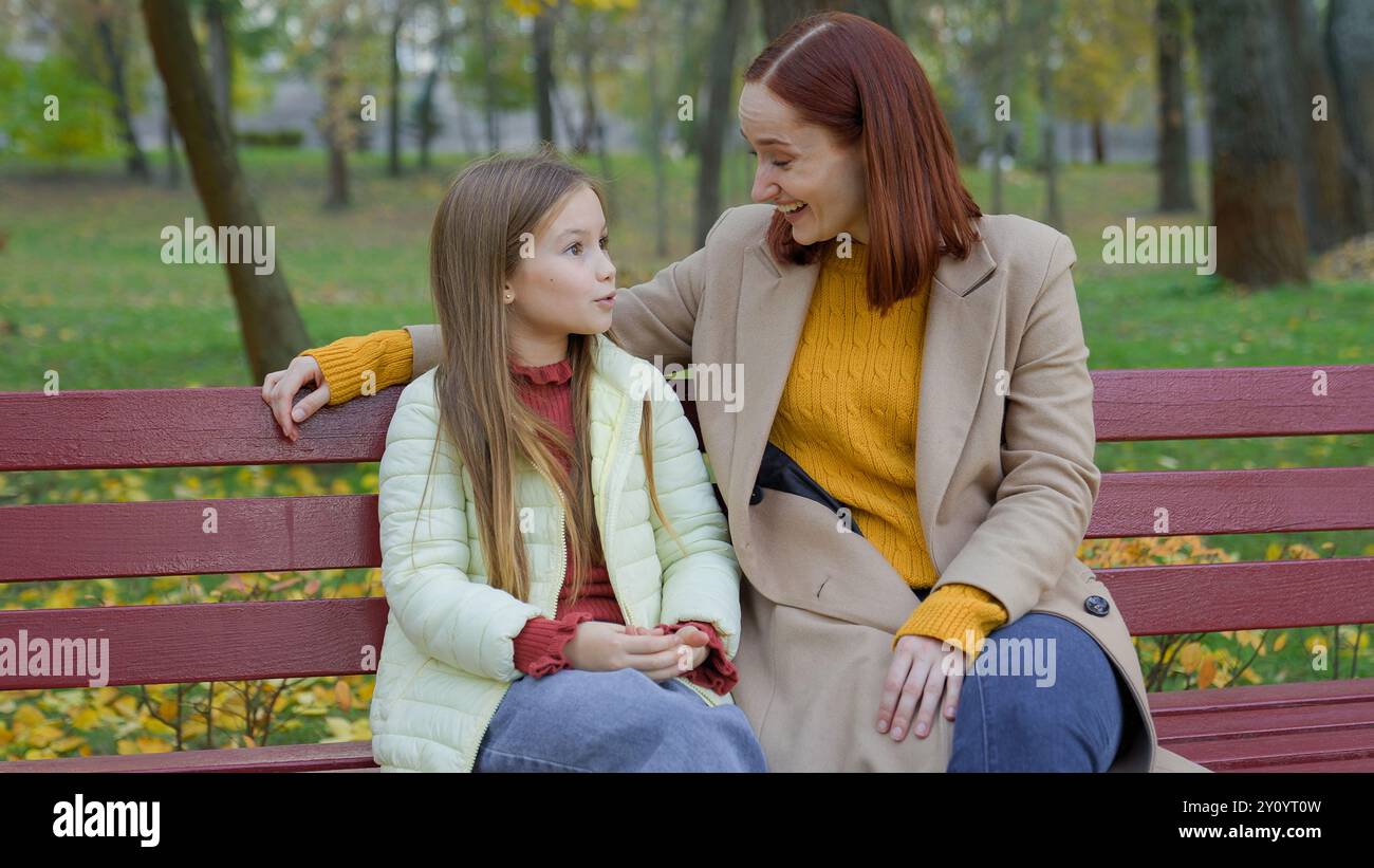 Caucasian woman mother mom talking with child girl kid daughter teen ...