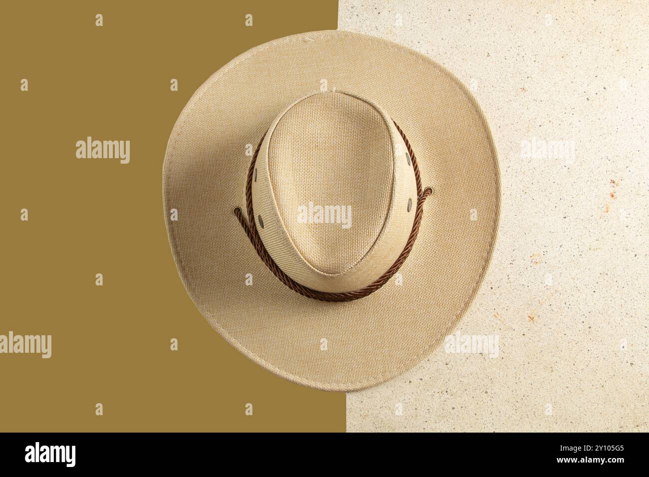 Close-up photo of a man's cowboy hat facing upwards, his hat is on a ...