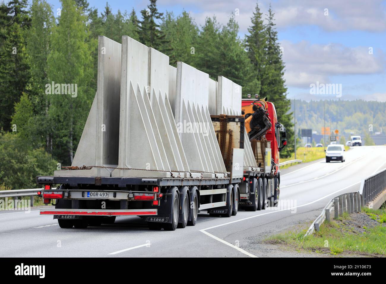 Volvo FH truck and trailer transporting tall precast concrete ...