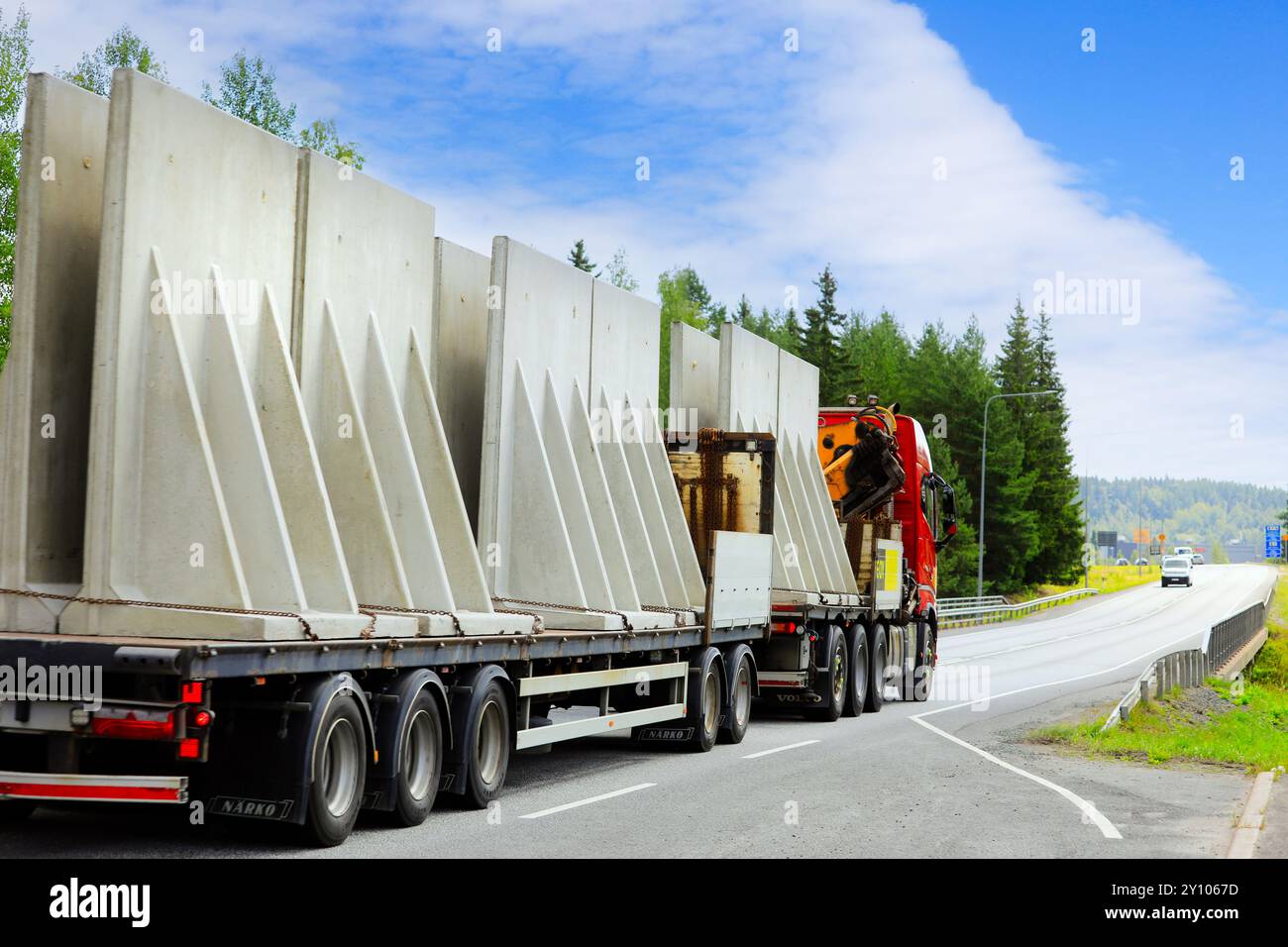 Volvo FH truck and trailer transporting tall precast concrete ...