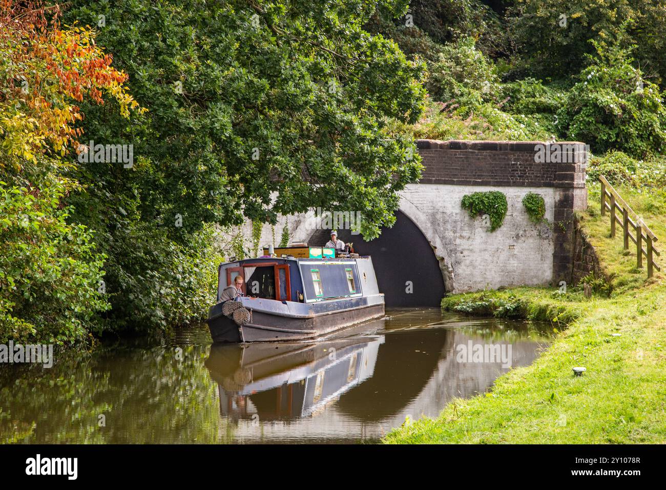 Canal narrowboat emerging from the Western end of the Saltersford ...