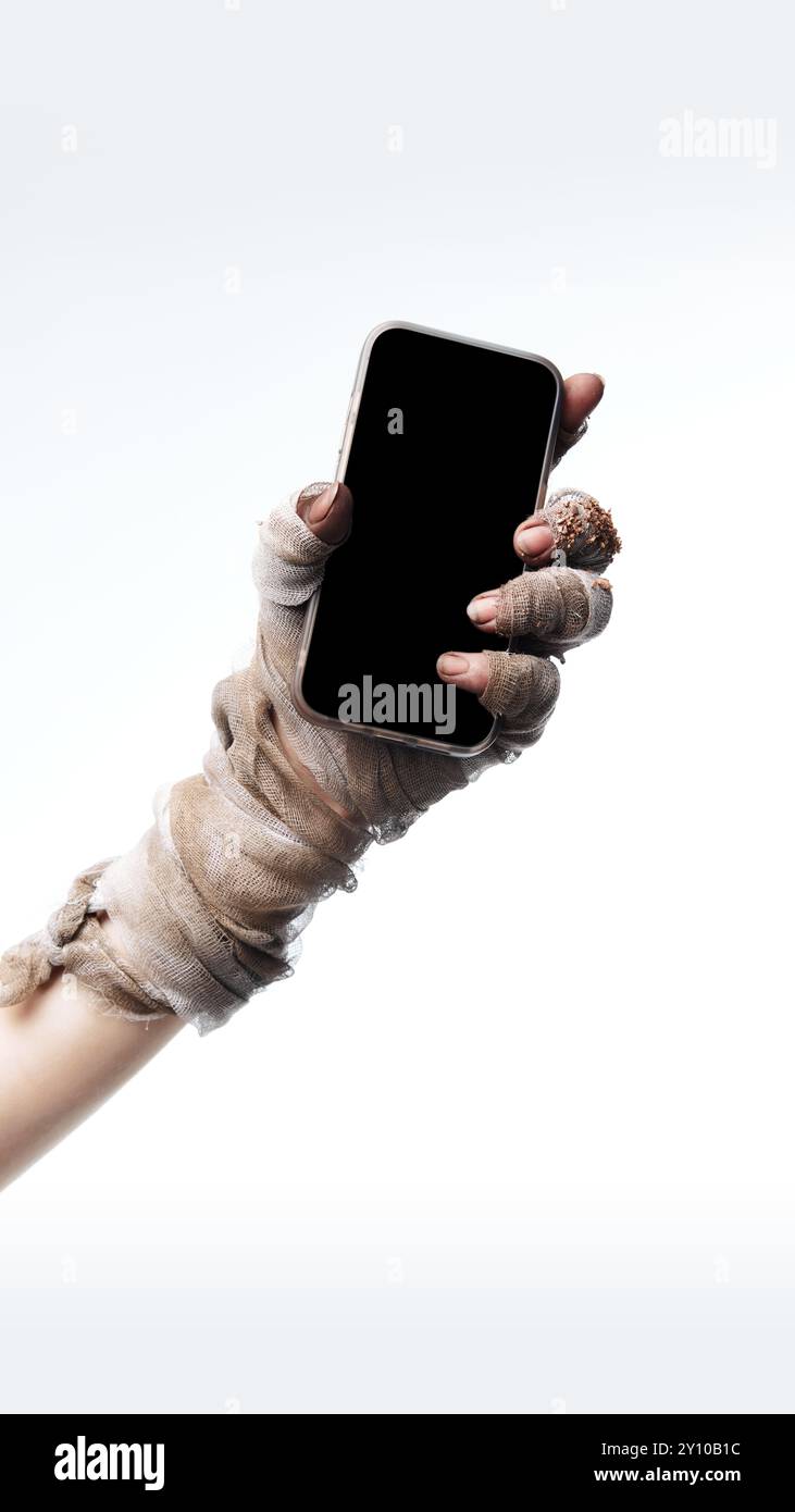Spooky zombie's hand holding modern smartphone with black screen ...