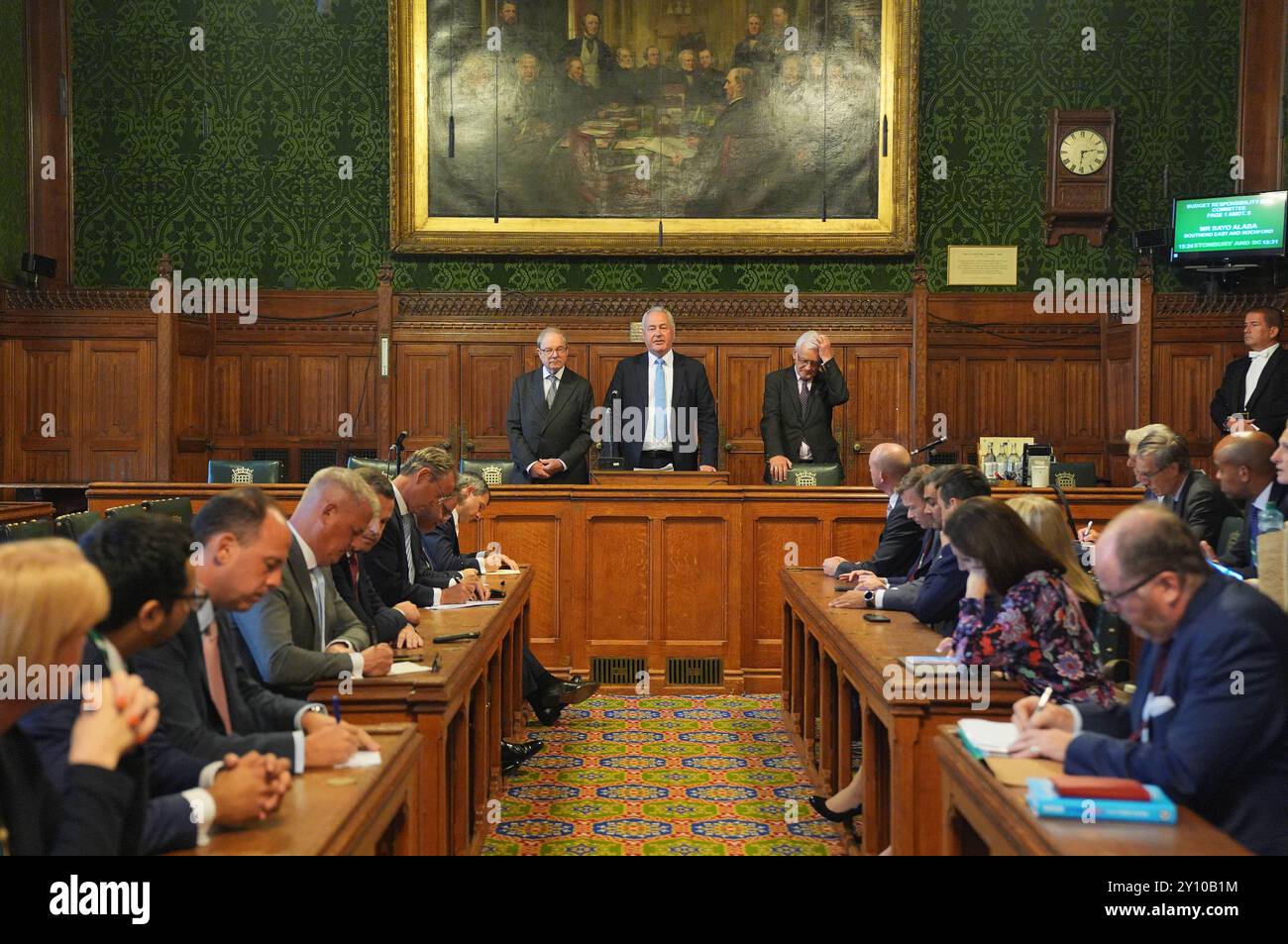 Bob Blackman, chairman of the 1922 Committee, (centre) announces the results of the first ballot ...