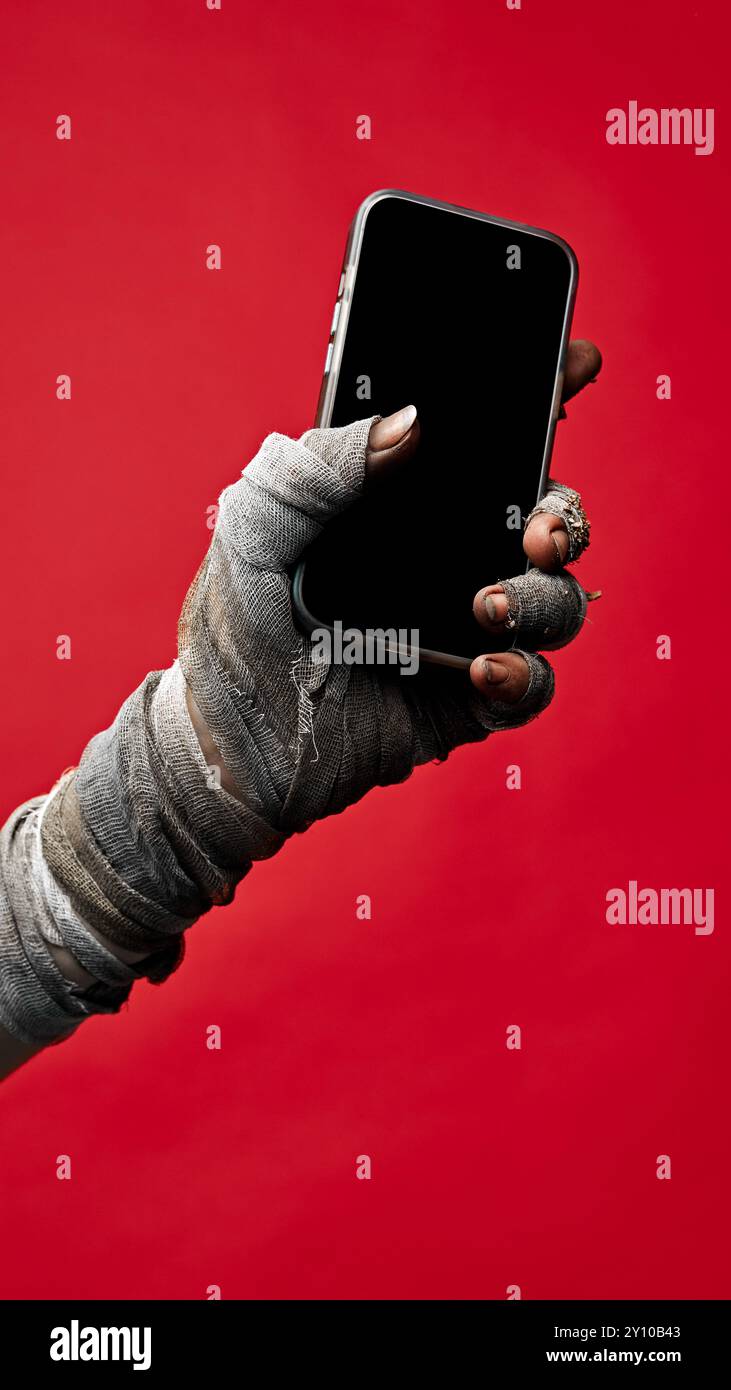 Terrifying hand, monster's hand holding digital smartphone with blank ...