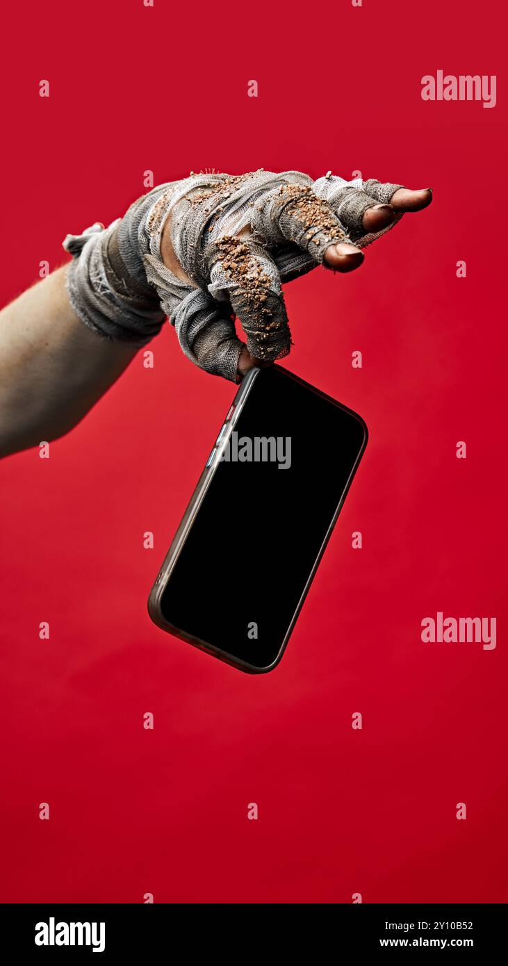 Terrifying hand, monster's hand holding digital smartphone with blank ...