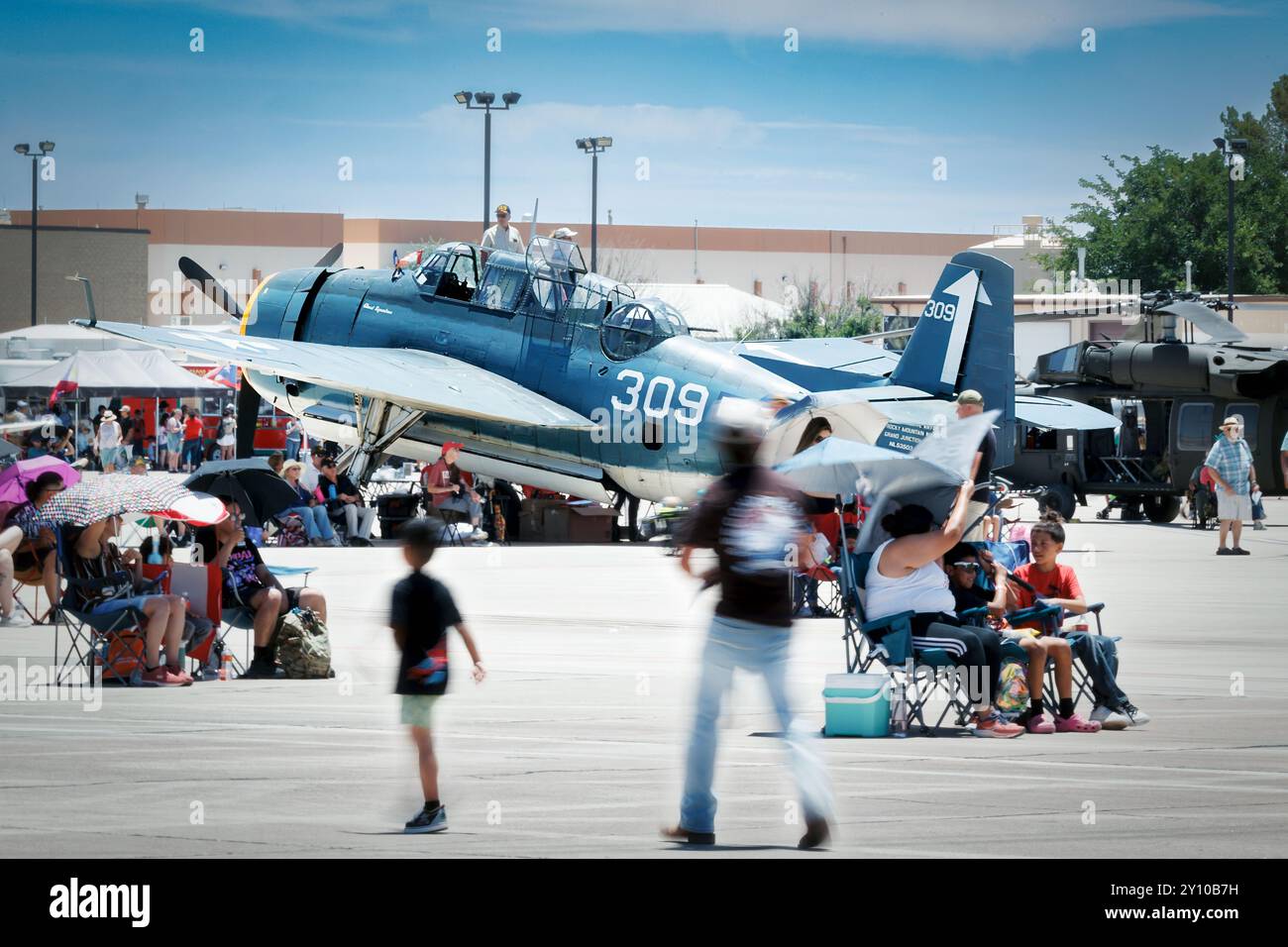 Crowds gather around a WWII TBM Avenger at the 2024 Legacy of Liberty ...