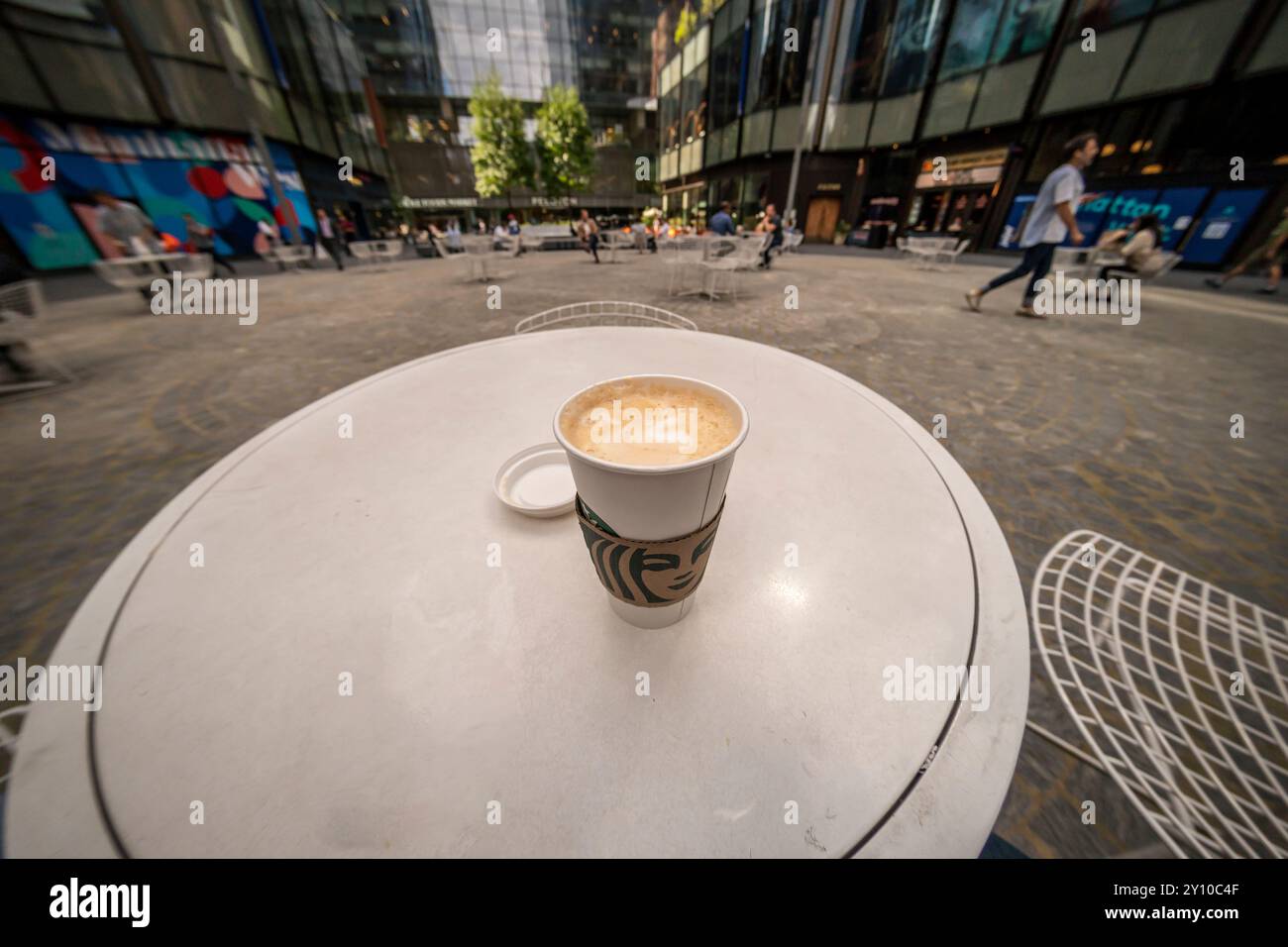 A grande Pumpkin Spice Latte from Starbucks is seen in the plaza of ...