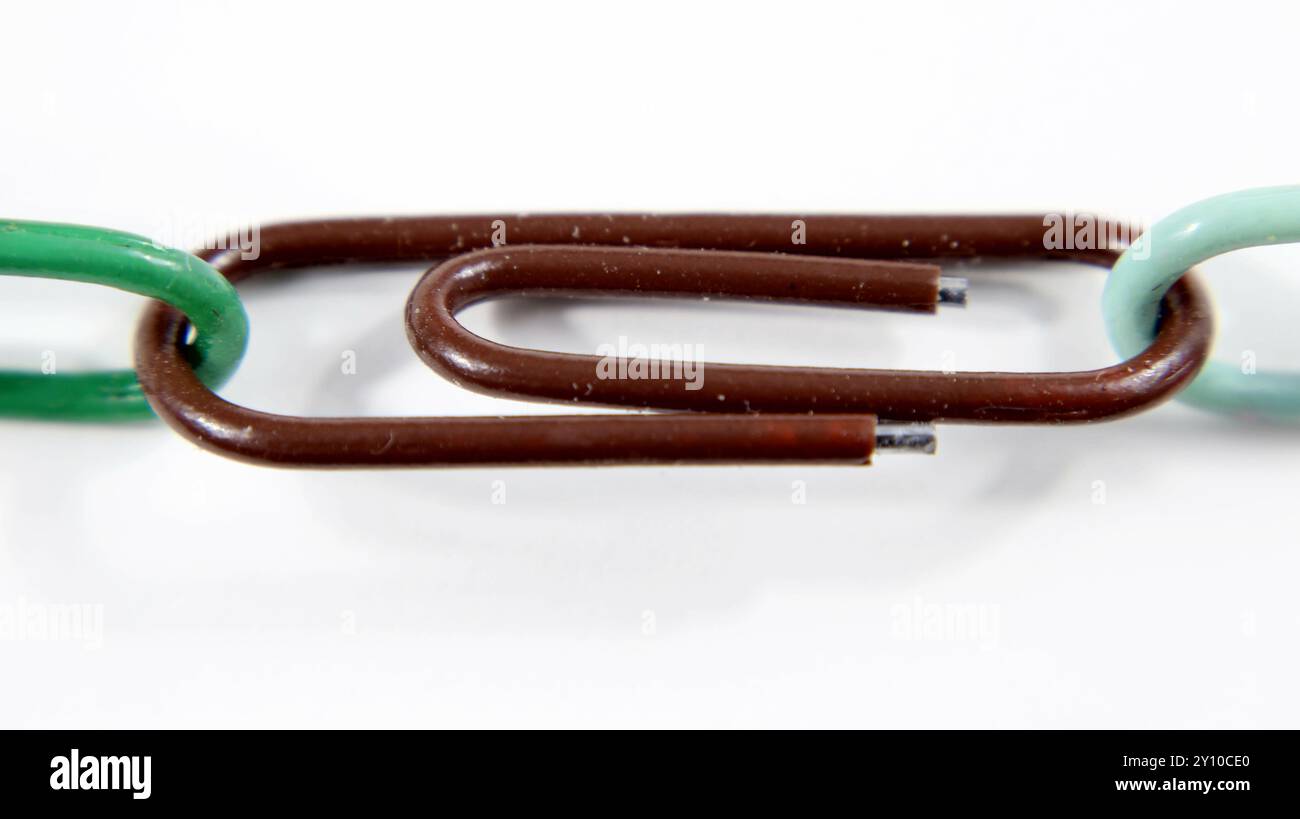 Focus on first floor shape of paper clip in office brown color over ...