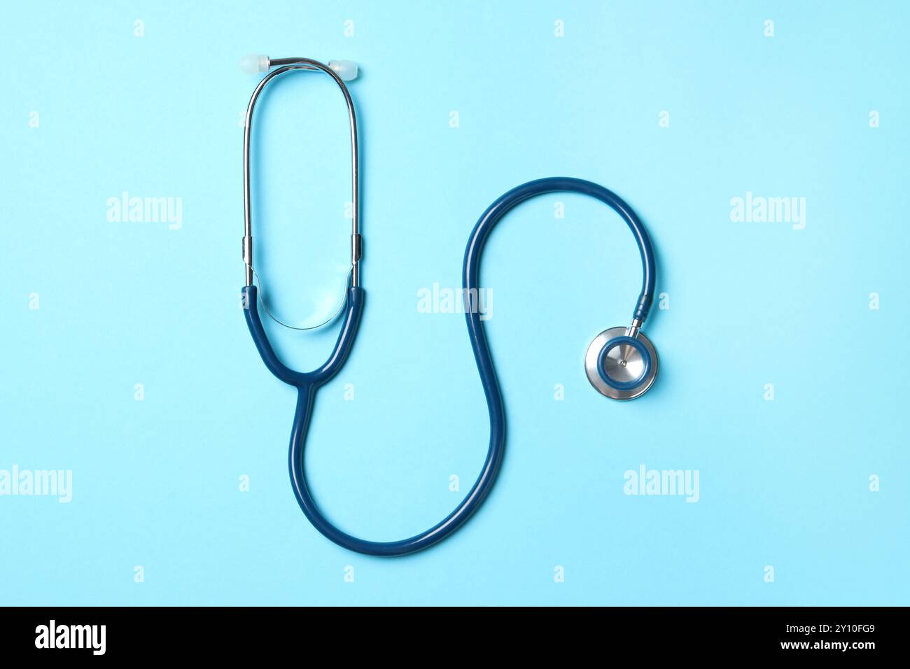 Stethoscope on light blue background, top view. Medical treatment Stock ...