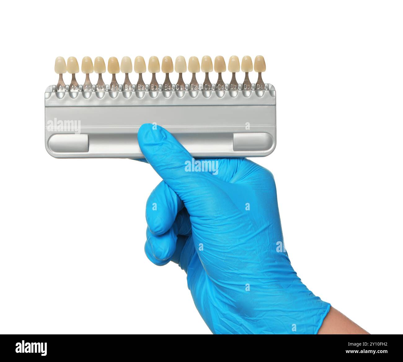 Doctor with teeth color chart on white background, closeup. Dental ...