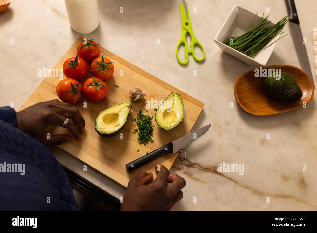 African american man preparing avocado hi-res stock photography and ...