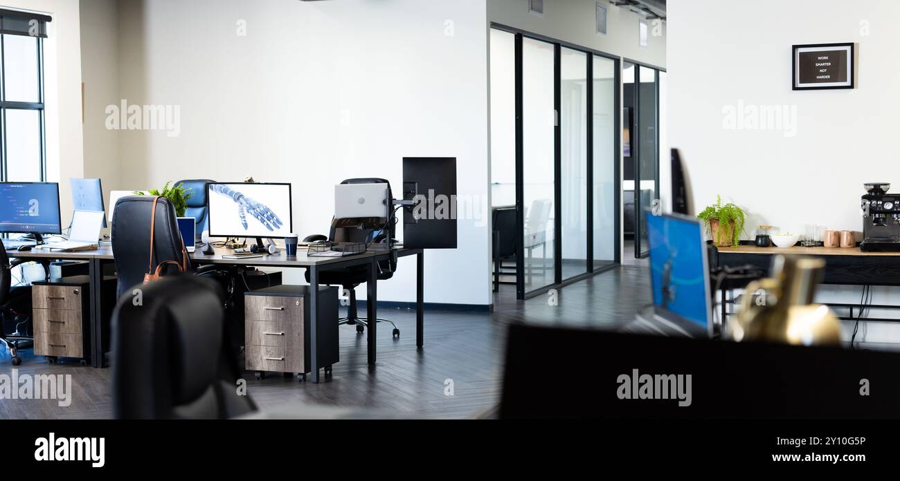 Modern office with multiple workstations and computers, featuring ...