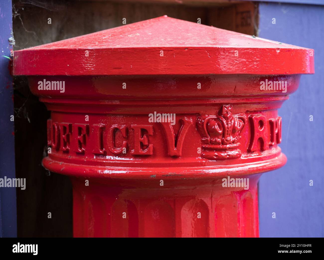 Closeup of Victorian red Royal Mail pillar box post box on High Street ...