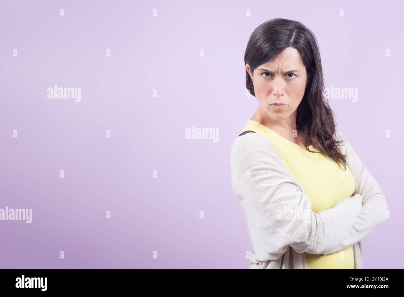 Pretty woman angrily looks standing hi-res stock photography and images ...