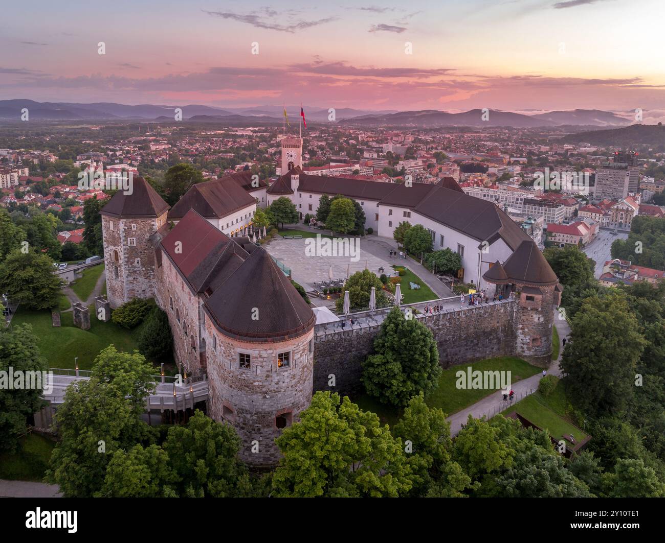 Aerial sunset view of Ljubljana castle and city with pentagonal bastion ...