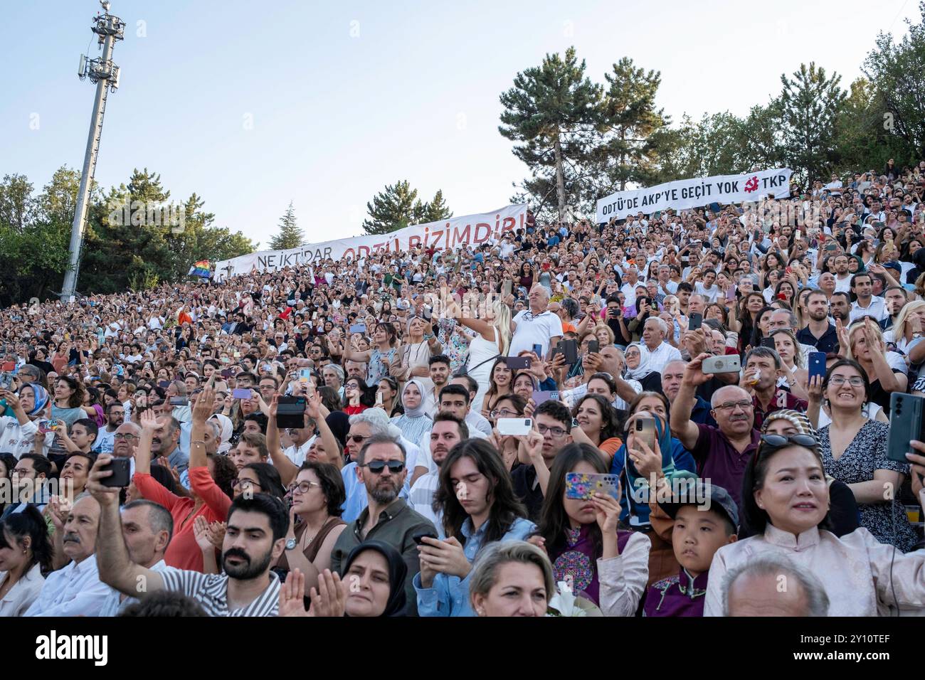 Students and their families watch the march. The graduation ceremony of ...