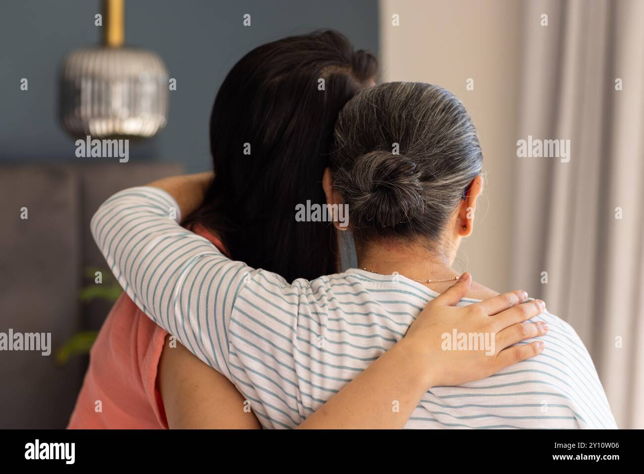 Embracing, asian grandmother and granddaughter showing support and ...