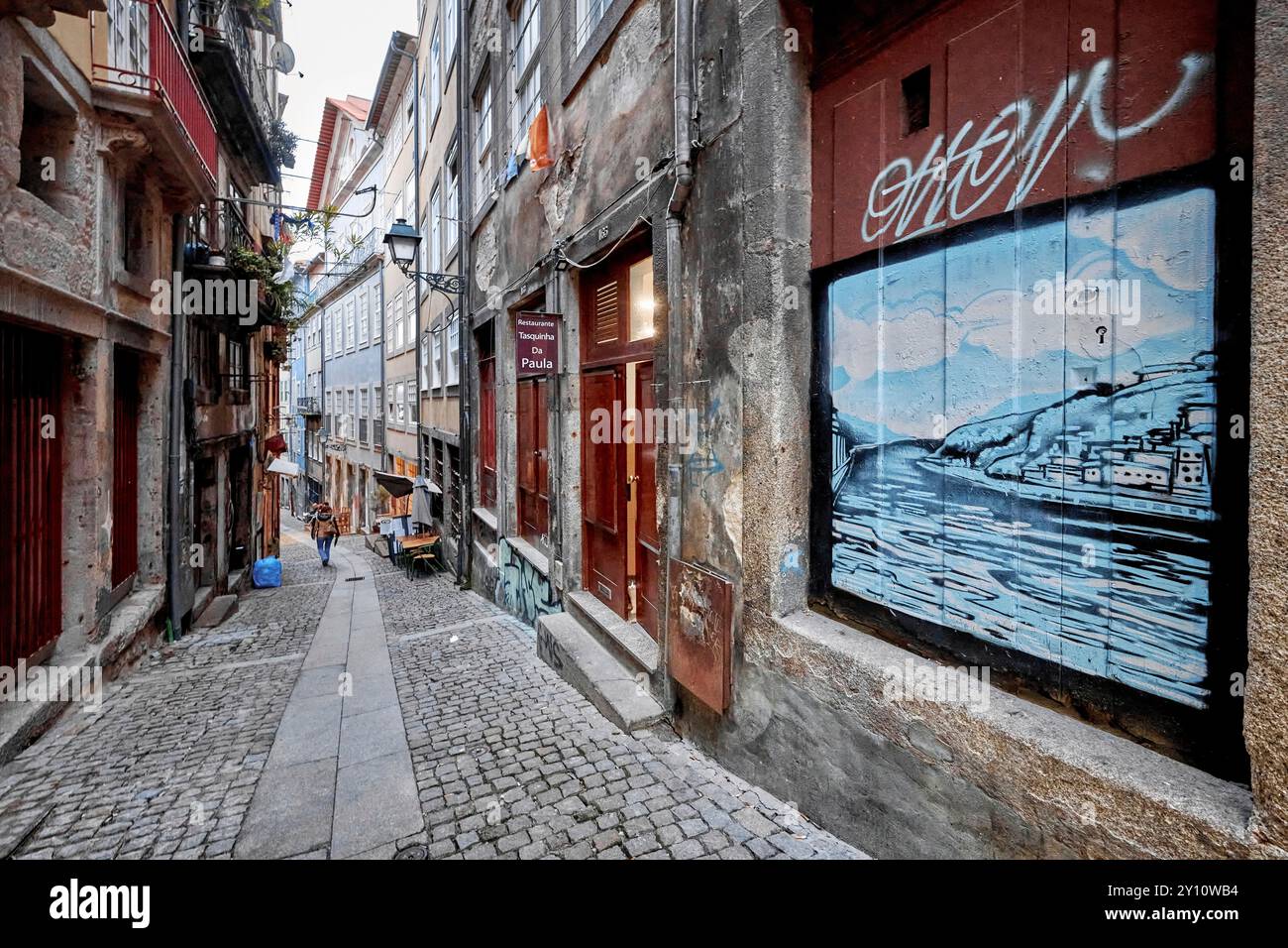 Old city center of Porto with narrow streets and small stores in the ...