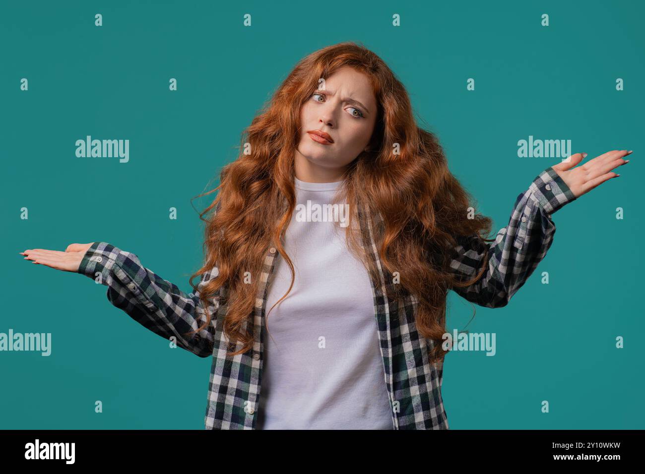 Confused stylish 20s aged woman, shoulders up - can't help, makes ...