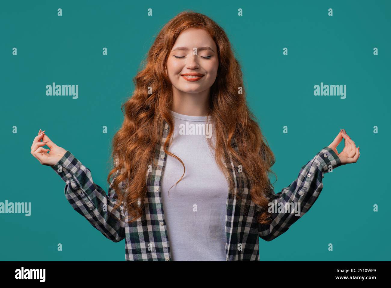 Tranquil woman relaxing, meditating, refuses stress. Ginger lady ...