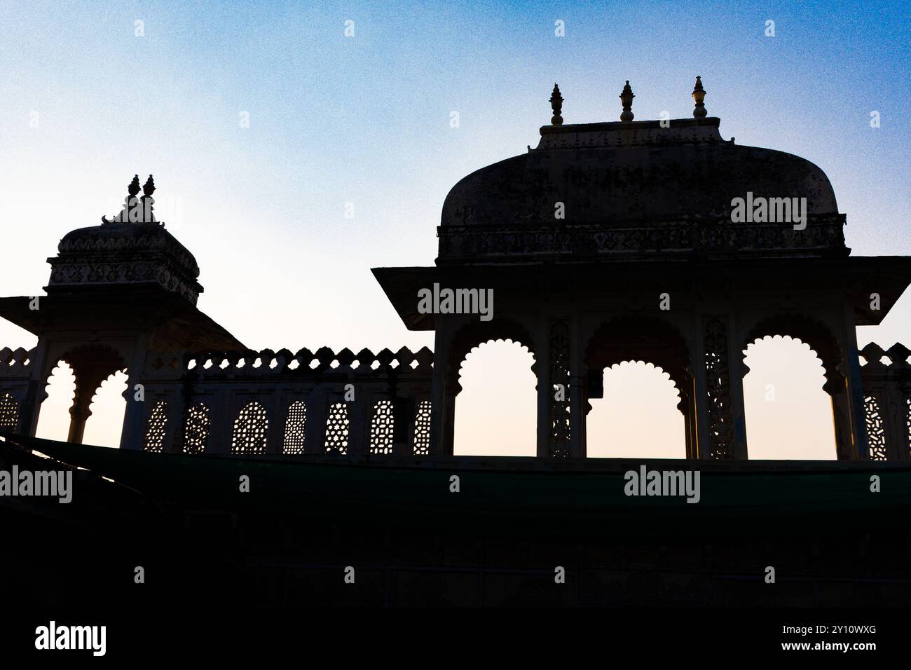 backlit shot of palace exterior with bright blue sky at morning image ...